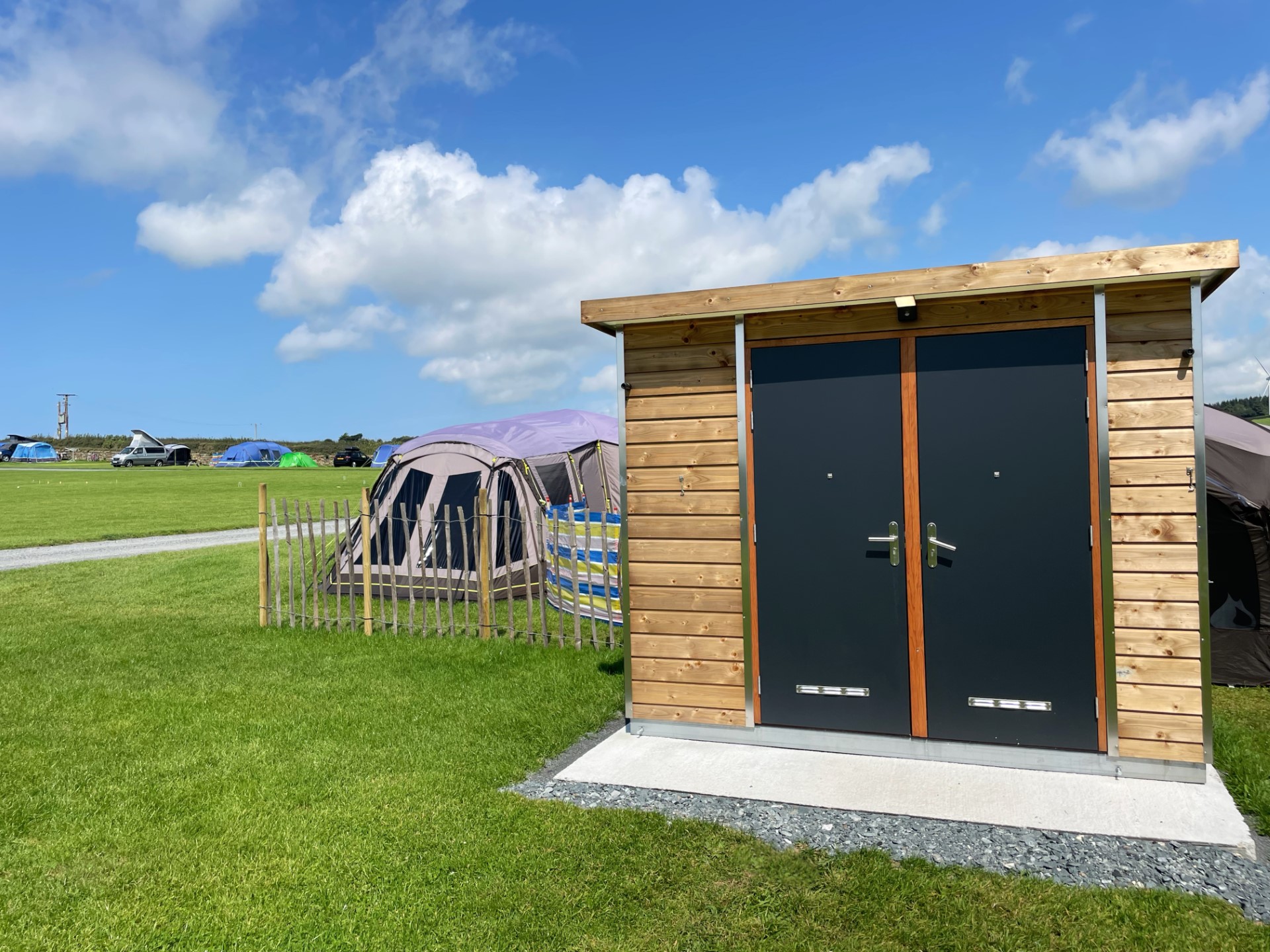 Grass Electric Pitch with Private Bathroom Pod